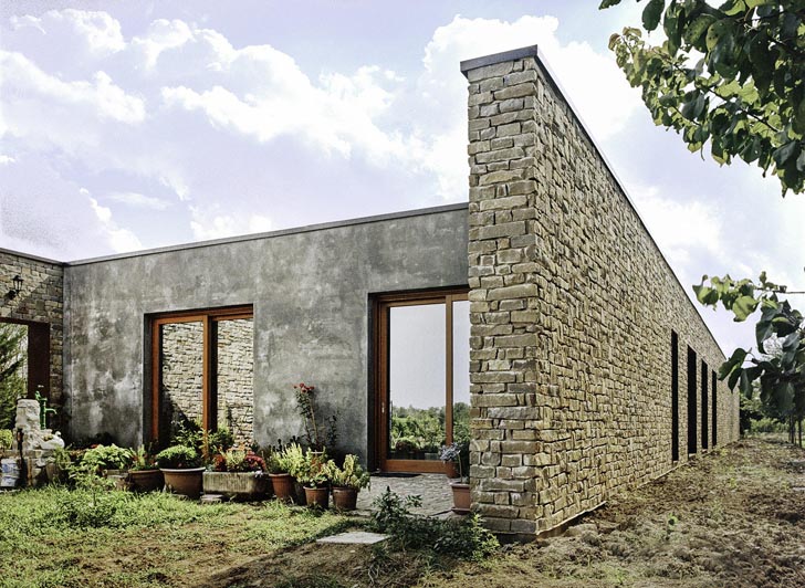 A brick wall perimeter gives Esse House privacy on the grounds of an ...