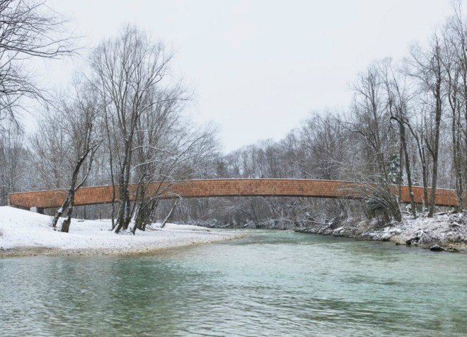 Architects create beautiful arched footbridge out of timber planks and ...
