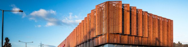Striking louvered facade controls solar gain and updates an aging ...