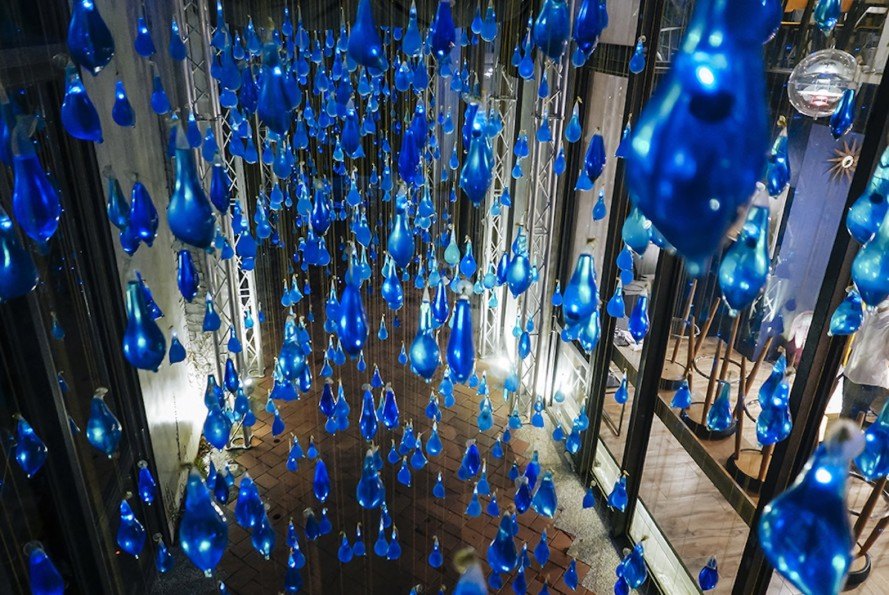 Thousands of water-filled condoms create an immersive “rainstorm” in Taiwan