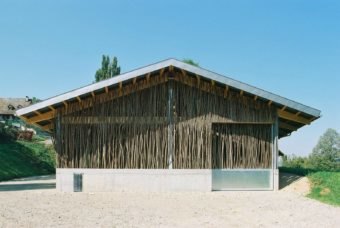 Beautiful cow barn in Basel is made of tree branches topped with a ...