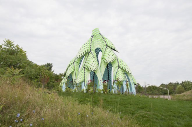This ultra-thin aluminum pavilion evokes a supernatural pine tree