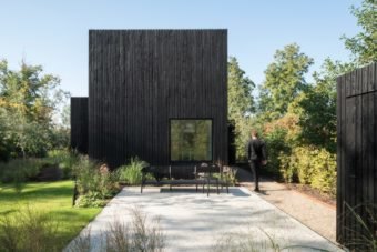 Jet black lakeside home in the Netherlands designed to embrace ...
