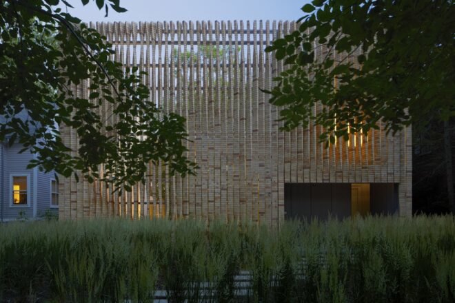 Twisting brick facade fronts an innovative courtyard house near Chicago
