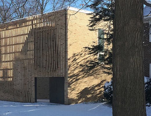 Twisting brick facade fronts an innovative courtyard house near Chicago