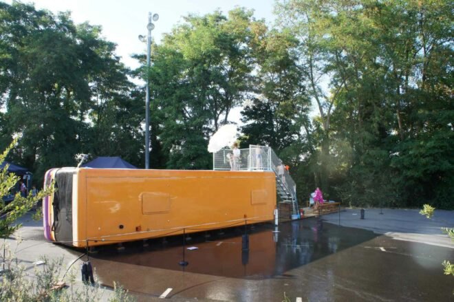 Artist converts old city bus into public swimming pool